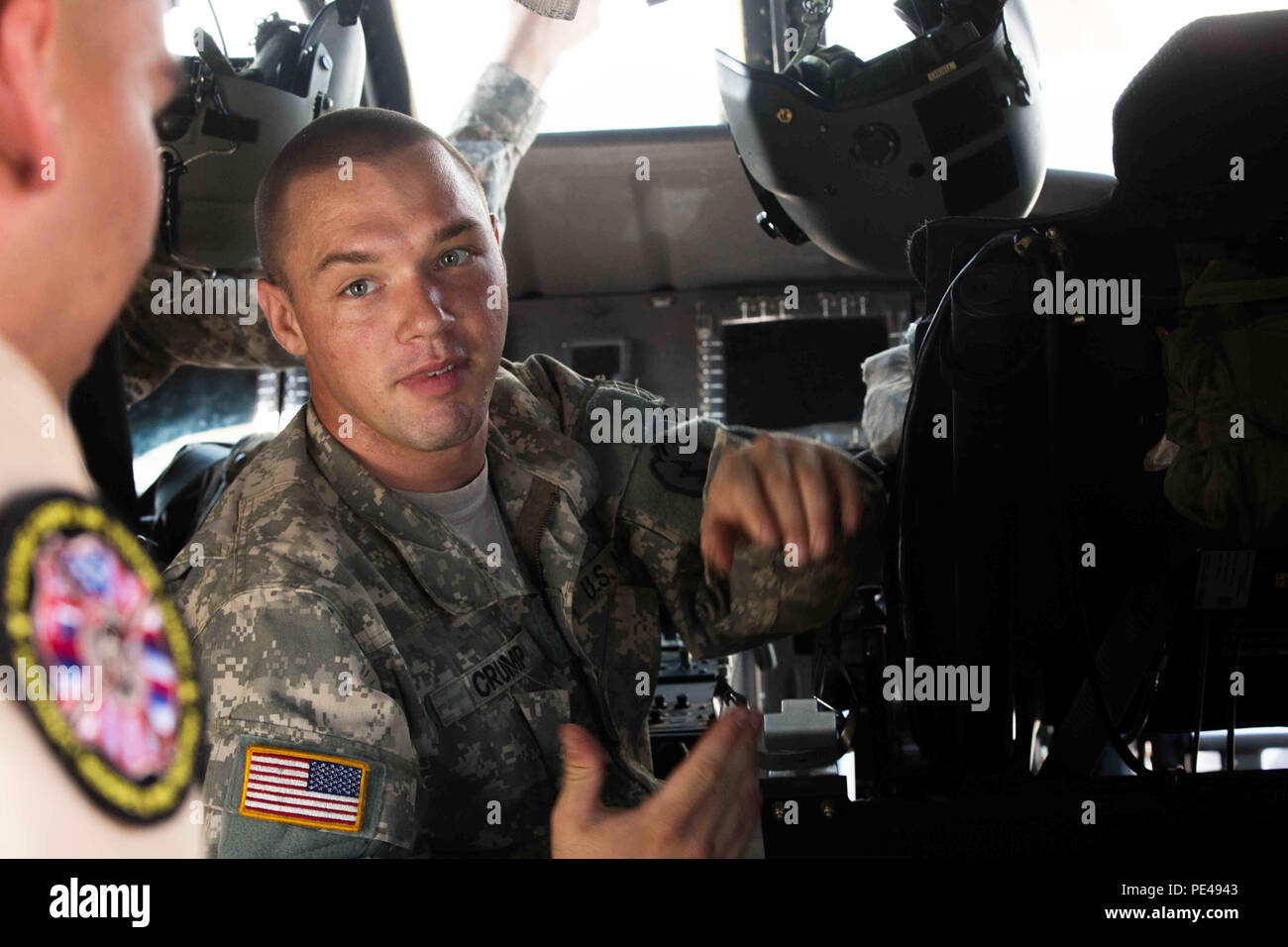 U.S. Army Spc. Austin Crump, a crew chief with Charlie Company, 3rd ...