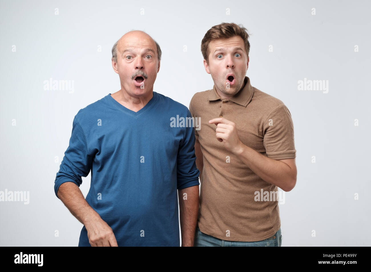 Surprised two men scared expressions hi-res stock photography and ...