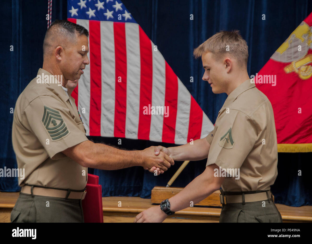 U.S. Marine Master Gunnery Sgt. John A. McGrath, left, the operations chief and acting sergeant ...