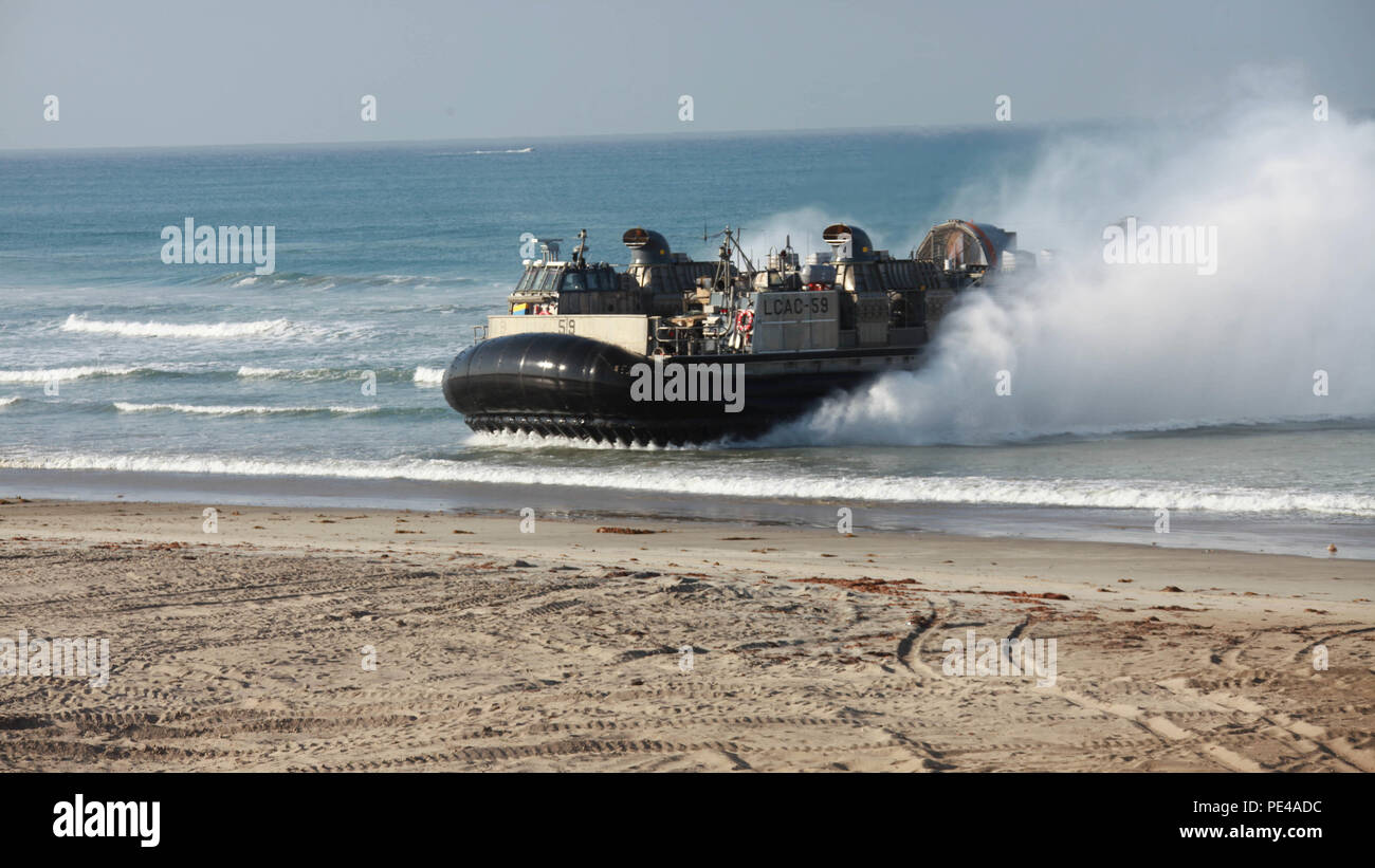 A U.S. Navy landing craft air cushion comes ashore on a Marine Corps ...