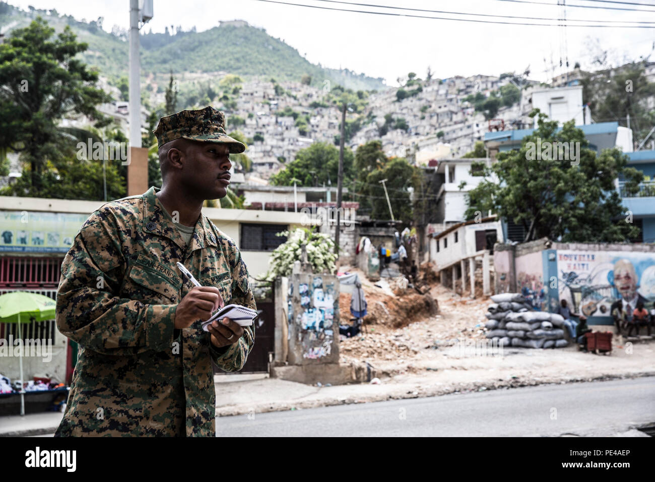 U.S. Marine Corps GySgt. Edwin Jean-Francois, a civil affairs chief ...