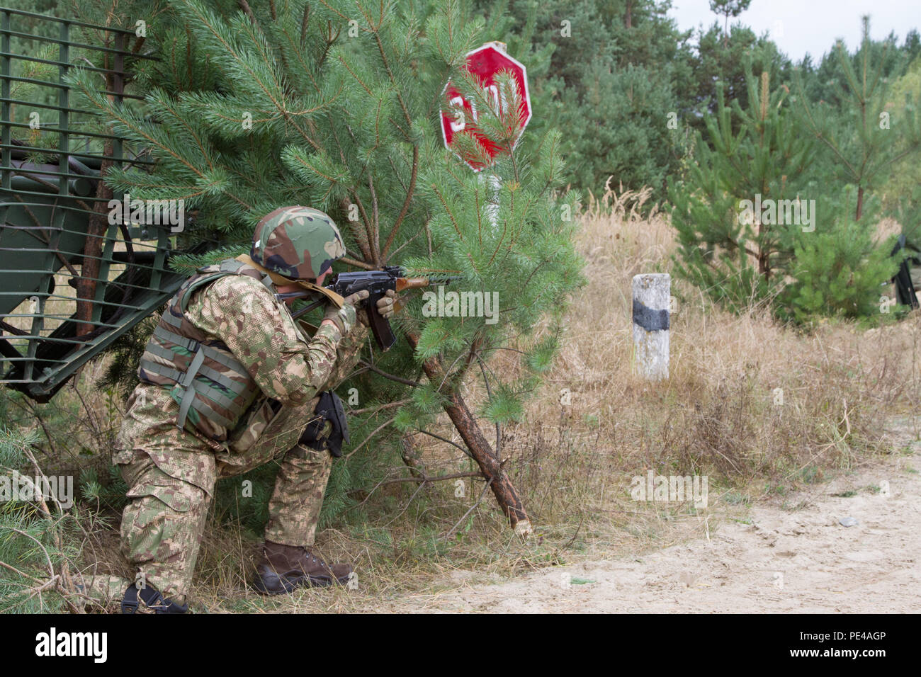 A Ukrainian national guard soldier takes aim as a vehicle approaches ...
