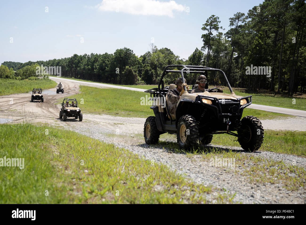 Marines with Alpha Company, 2nd Reconnaissance Battalion drive Polaris ...