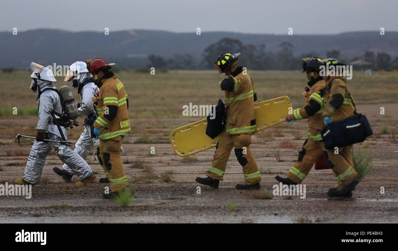 Marines with Aircraft Rescue and Firefighting and base firefighters ...
