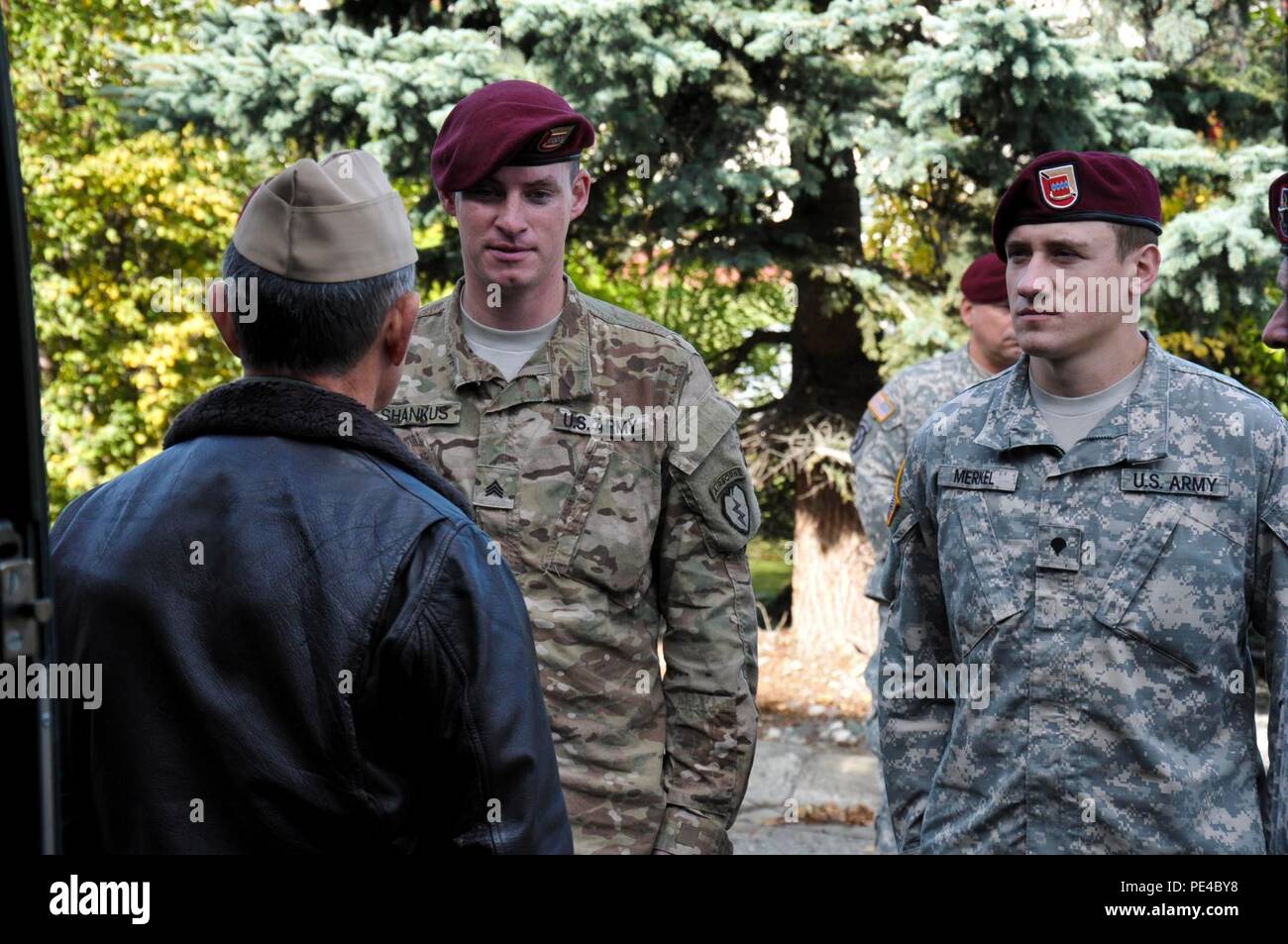 Sgt. Joshua Shankus, (center) a truck driver with the 725th Brigade ...
