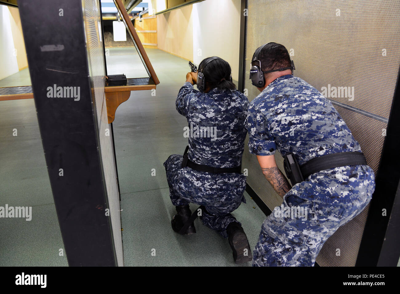 U.S. Navy Sailors assigned to USS Mount Whitney (LCC-20) shoot in a ...