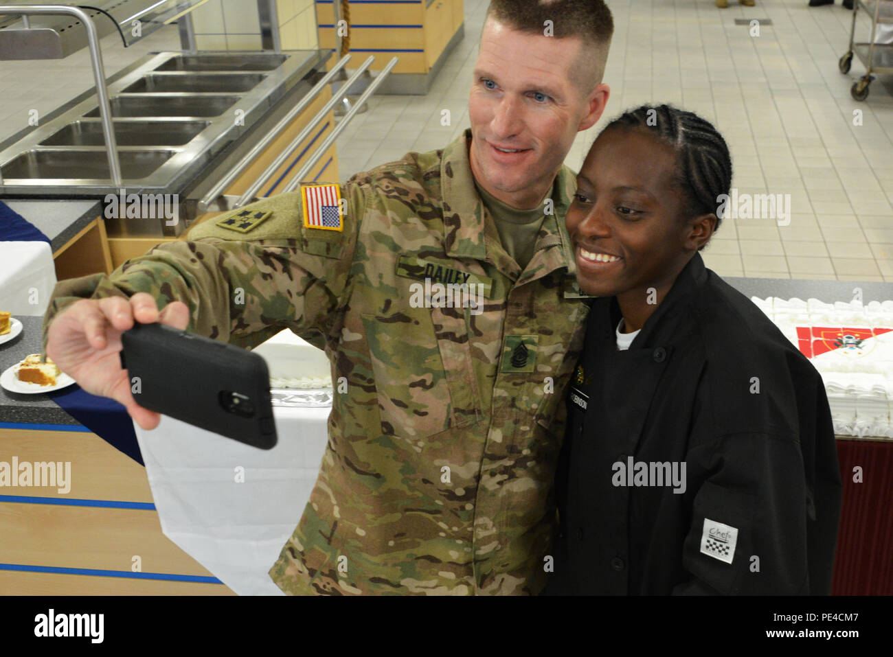 Sgt. Maj. of the Army Daniel A. Dailey (left) takes selfies with ...