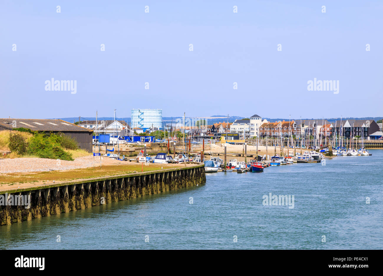 View along the River Arun estuary with moored sailing boats at ...