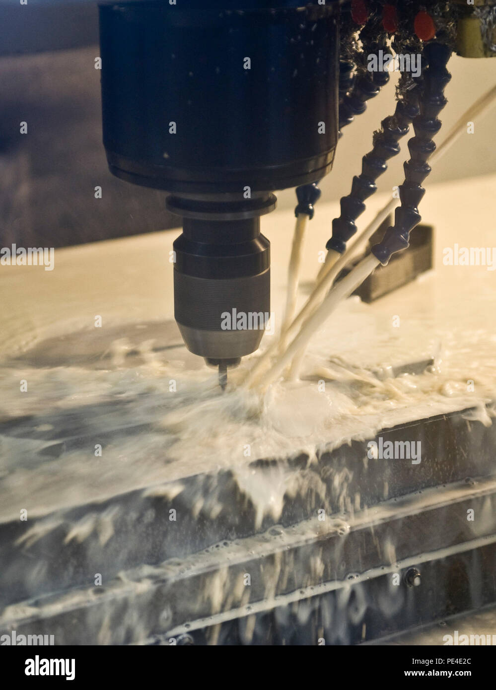 Hoses pour coolant inside a Vertical Milling Center at the Aircratft ...