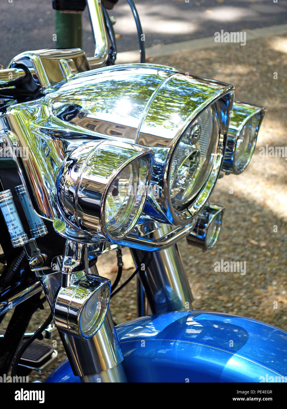 Closeup of the Headlamp cluster on a blue Harley-Davidson FLHRC Road ...