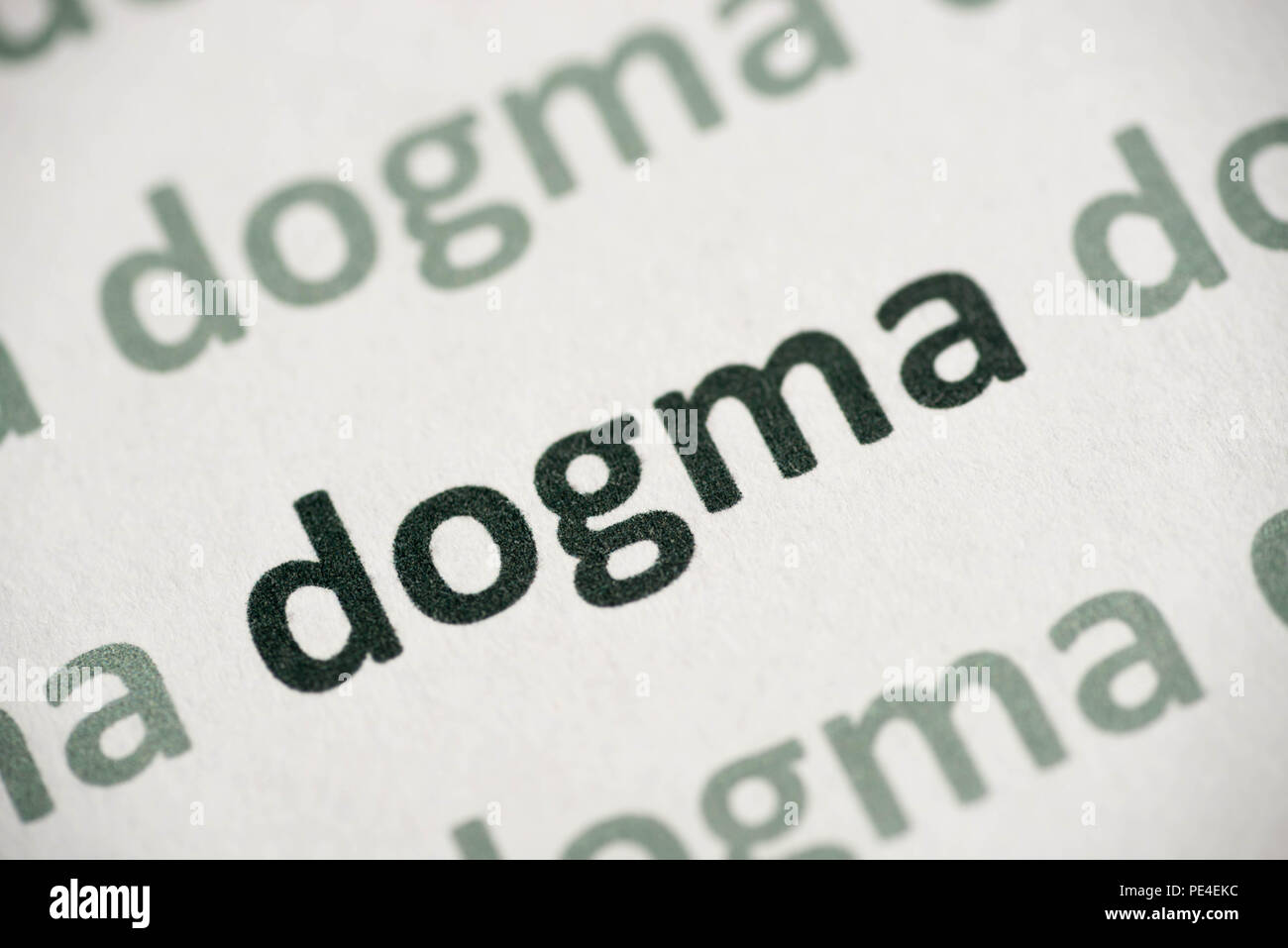 word dogma printed on white paper macro Stock Photo - Alamy