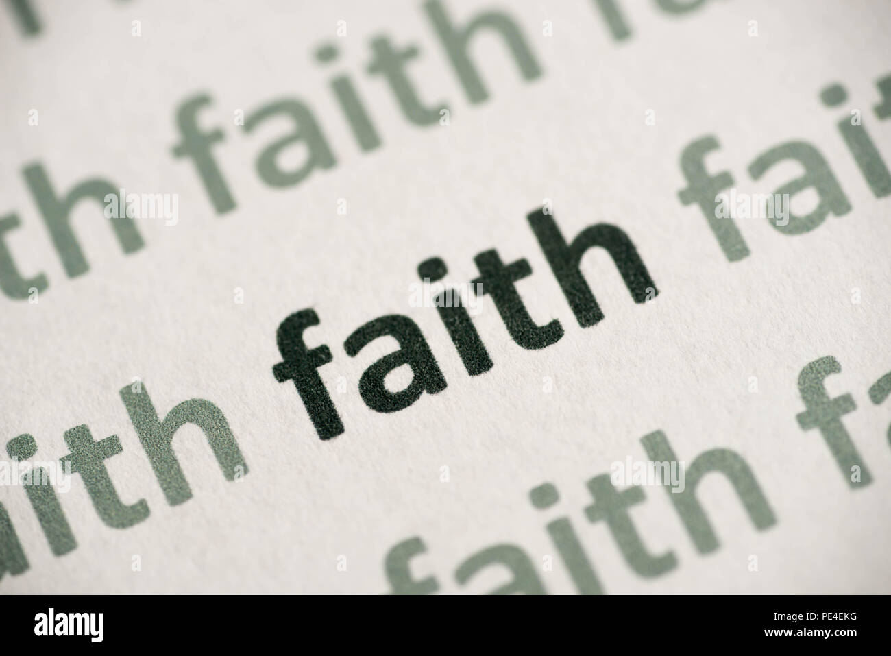 word faith printed on white paper macro Stock Photo - Alamy