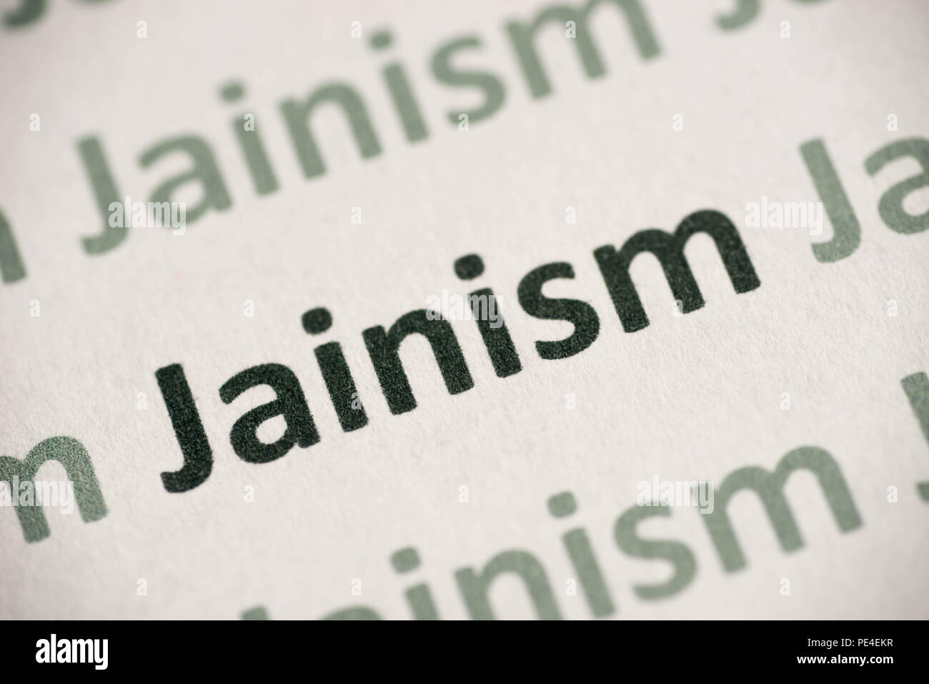 word Jainism printed on white paper macro Stock Photo - Alamy