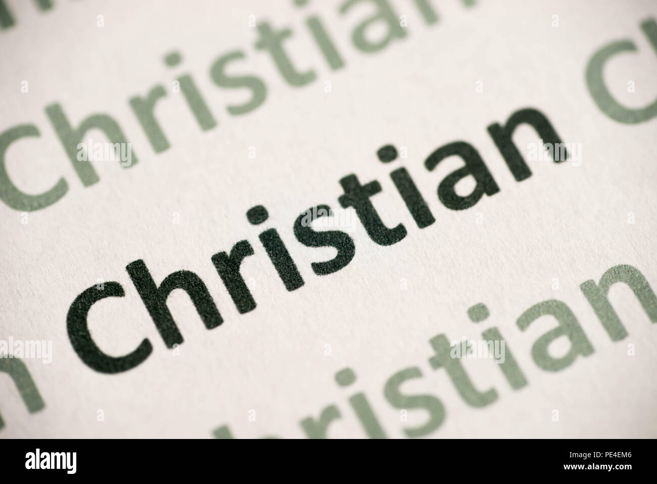 word Christian printed on white paper macro Stock Photo - Alamy