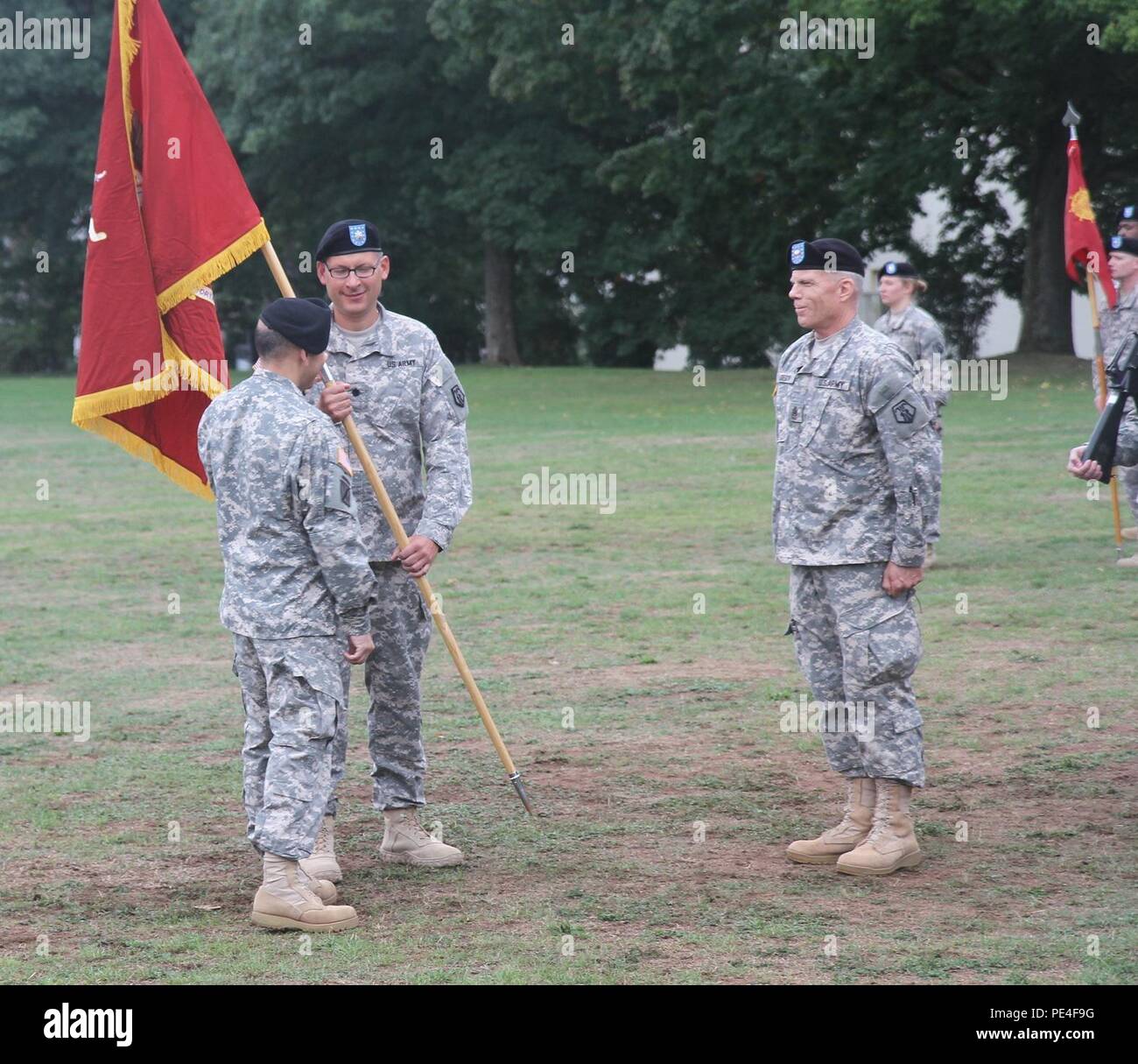 Lt. Col. Aaron Justice receives the colors from Col. Miguel Castellanos ...