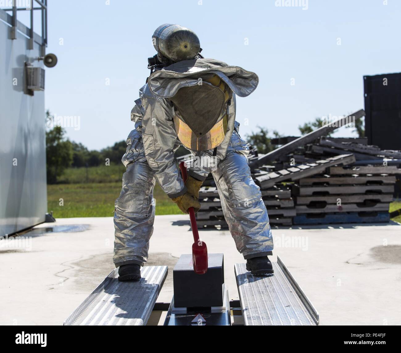 A competitor in the firefighter combat challenge portion of the 2015 ...