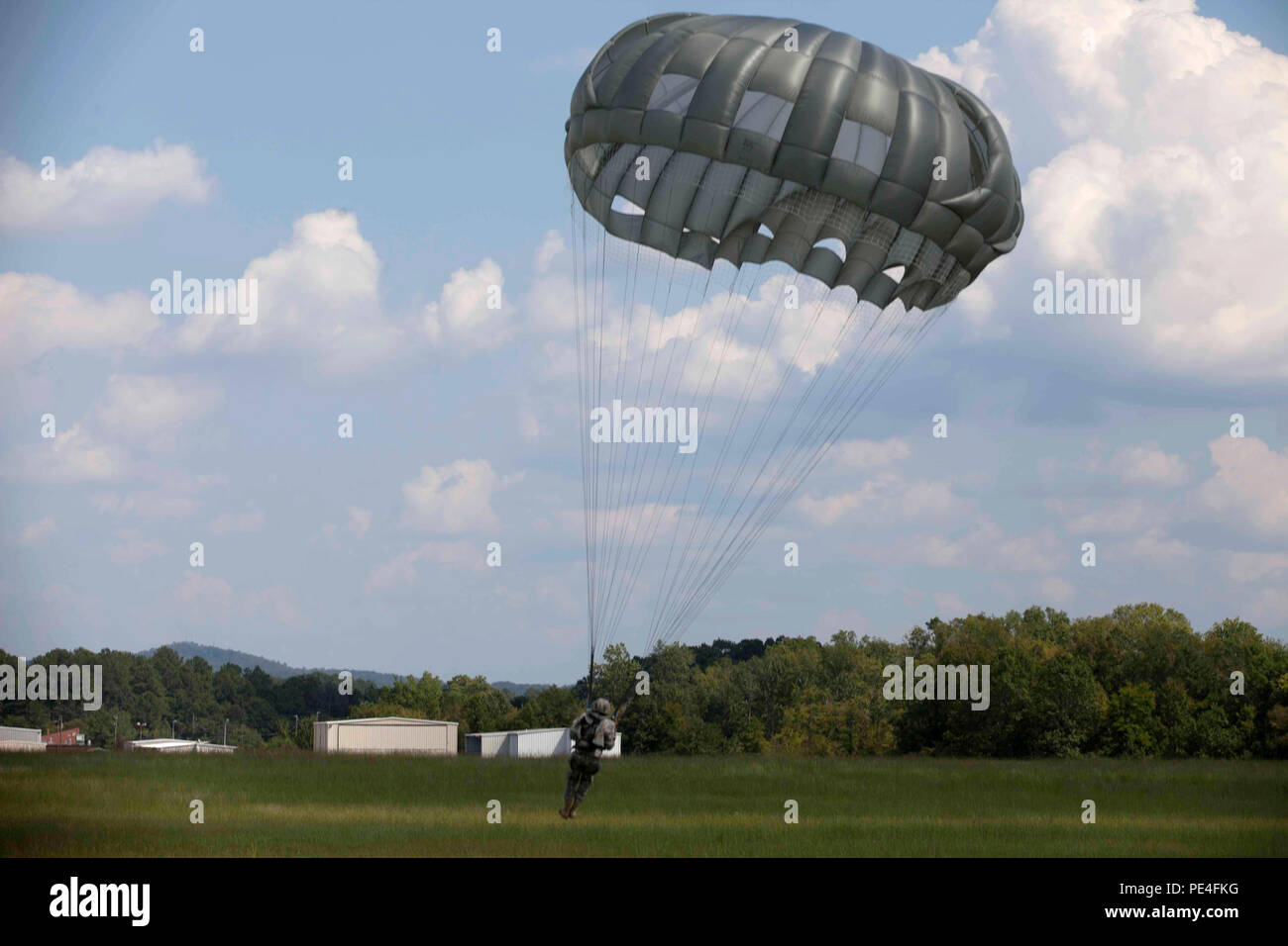 A U.S. Army paratrooper descends onto Steve Osborne drop zone for a ...