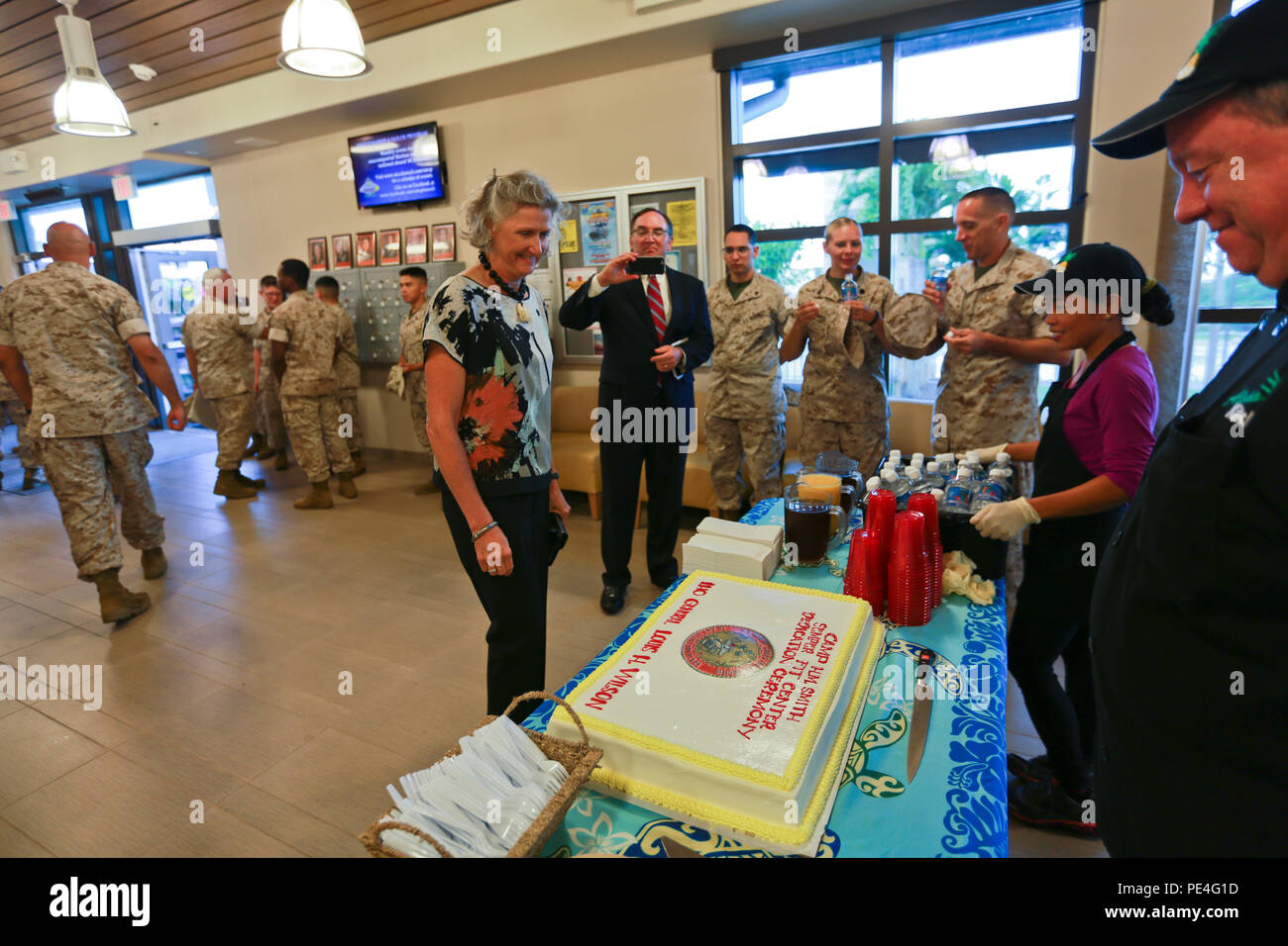 Janet Taylor looks at the cake and refreshments given out after the ...