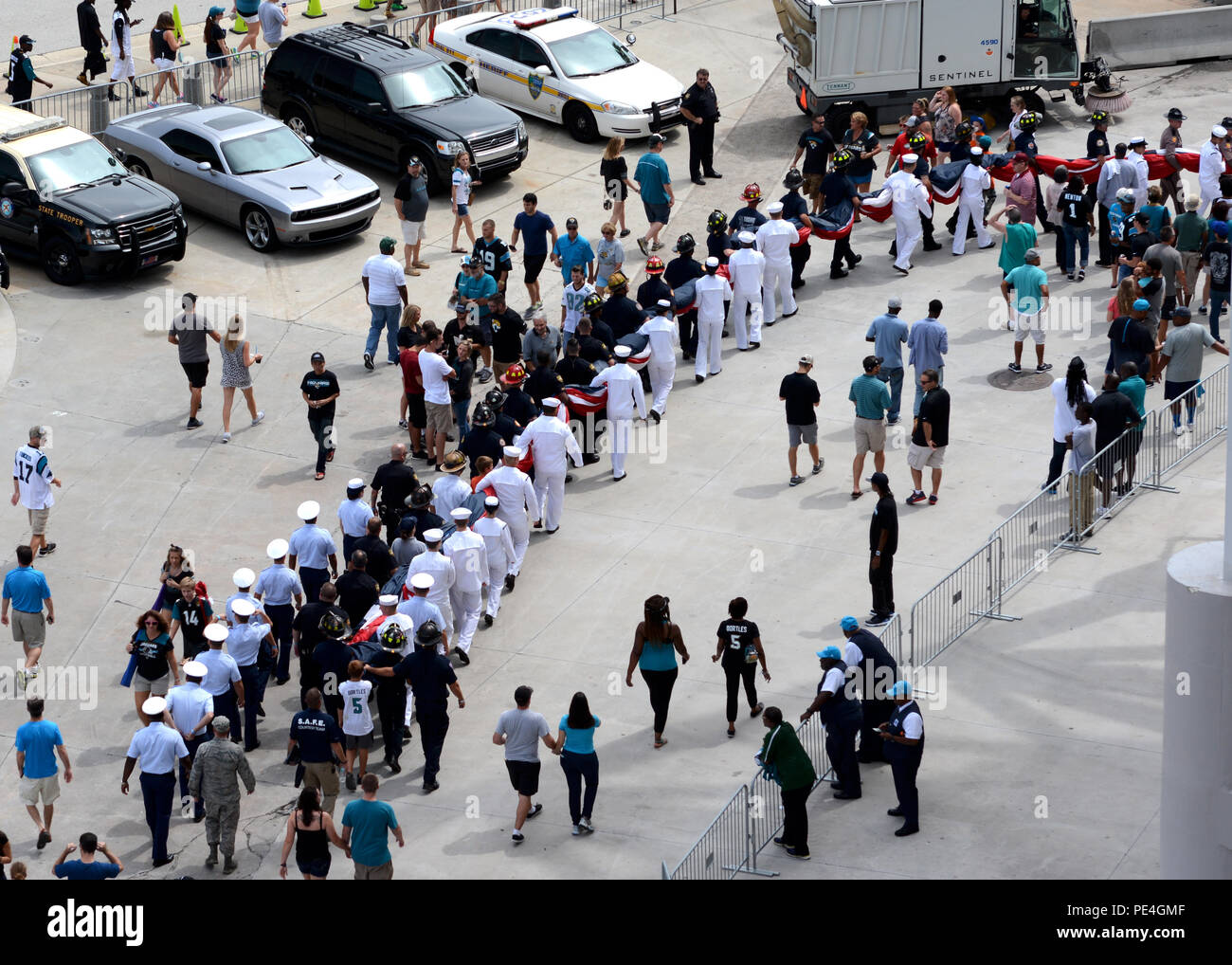 Local U.S. military and first responders carry a football field sized ...