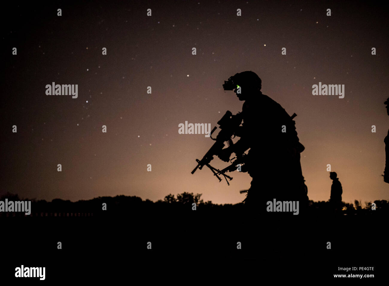 Canadian Army soldiers wait their turn to fire during a light machine ...
