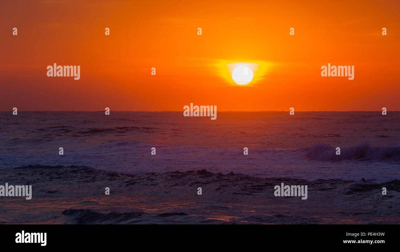 Dawn beach ocean waves horizon sunrise landscape Stock Photo - Alamy