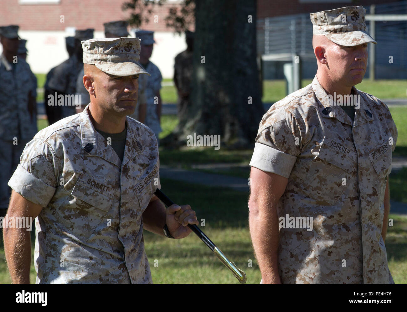 Sergeant Maj. Scott Schmitt stands with the non-commissioned officer’s ...