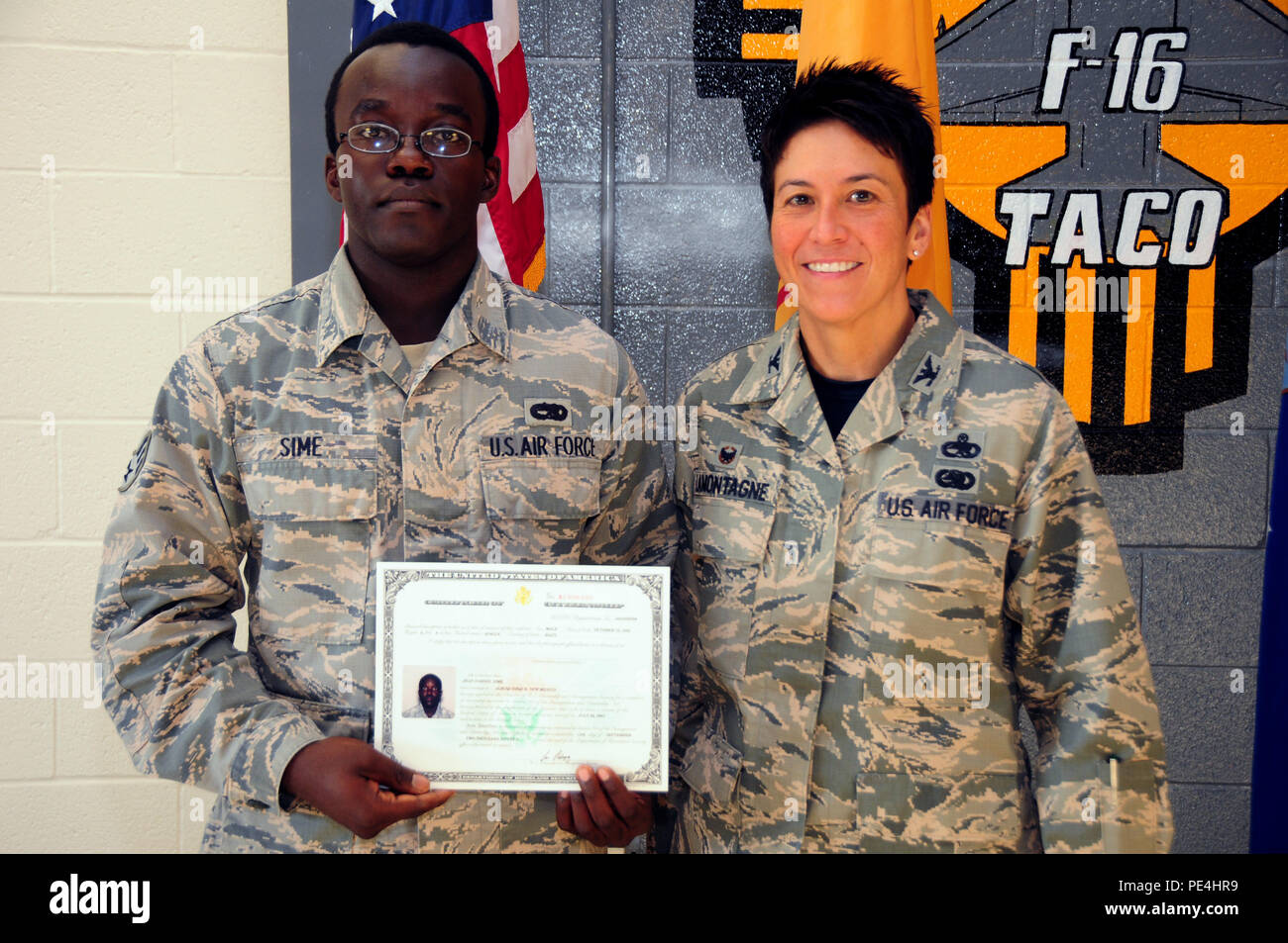 Lt. Col. Michelle LaMontagne and Senior Airman Jean Sime pose together ...