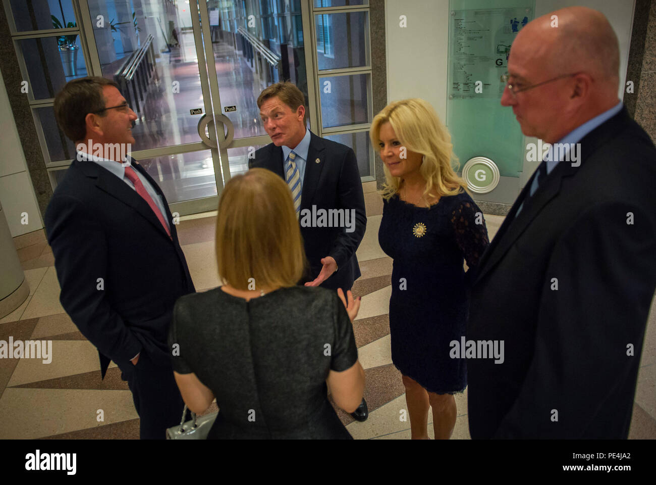 Secretary of Defense Ash Carter and his wife, Stephanie, speak and are ...