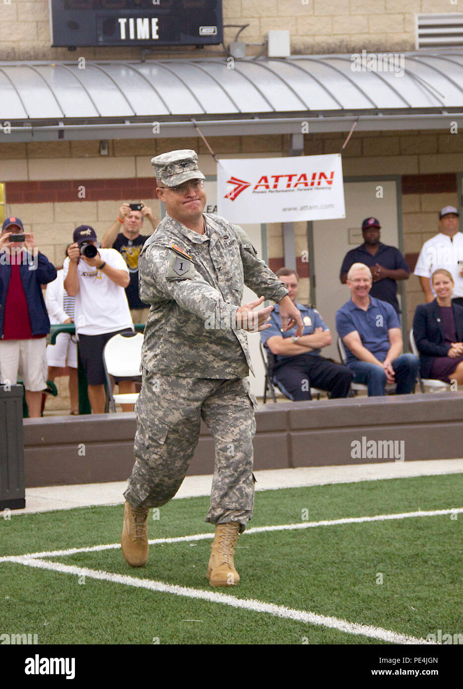 Col. Mike Henderson, commander, Joint Base Myer-Henderson Hall, throws ...