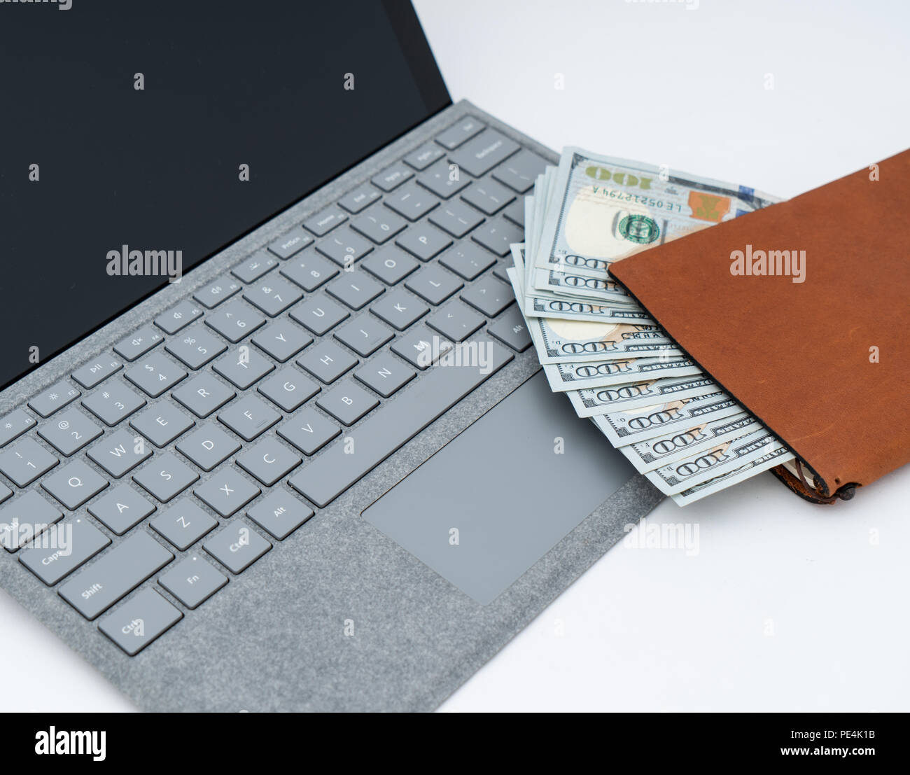 Money and computer man hi-res stock photography and images - Alamy