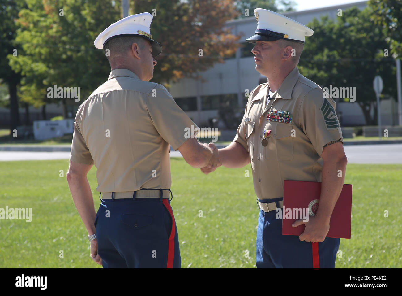 U.S. Marine Corps Master Sgt. Jay Wilfrom, right, the adjutant chief ...