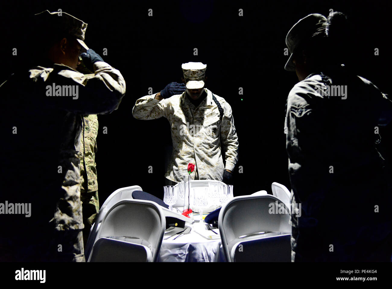 A joint service honor guard pays respect to service members at the POW ...