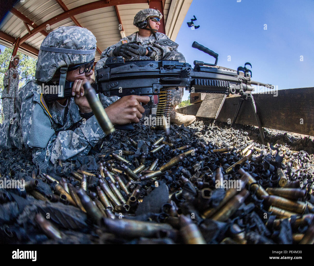 A Soldier in Basic Combat Training with E Company, Lightning Bn., fires ...