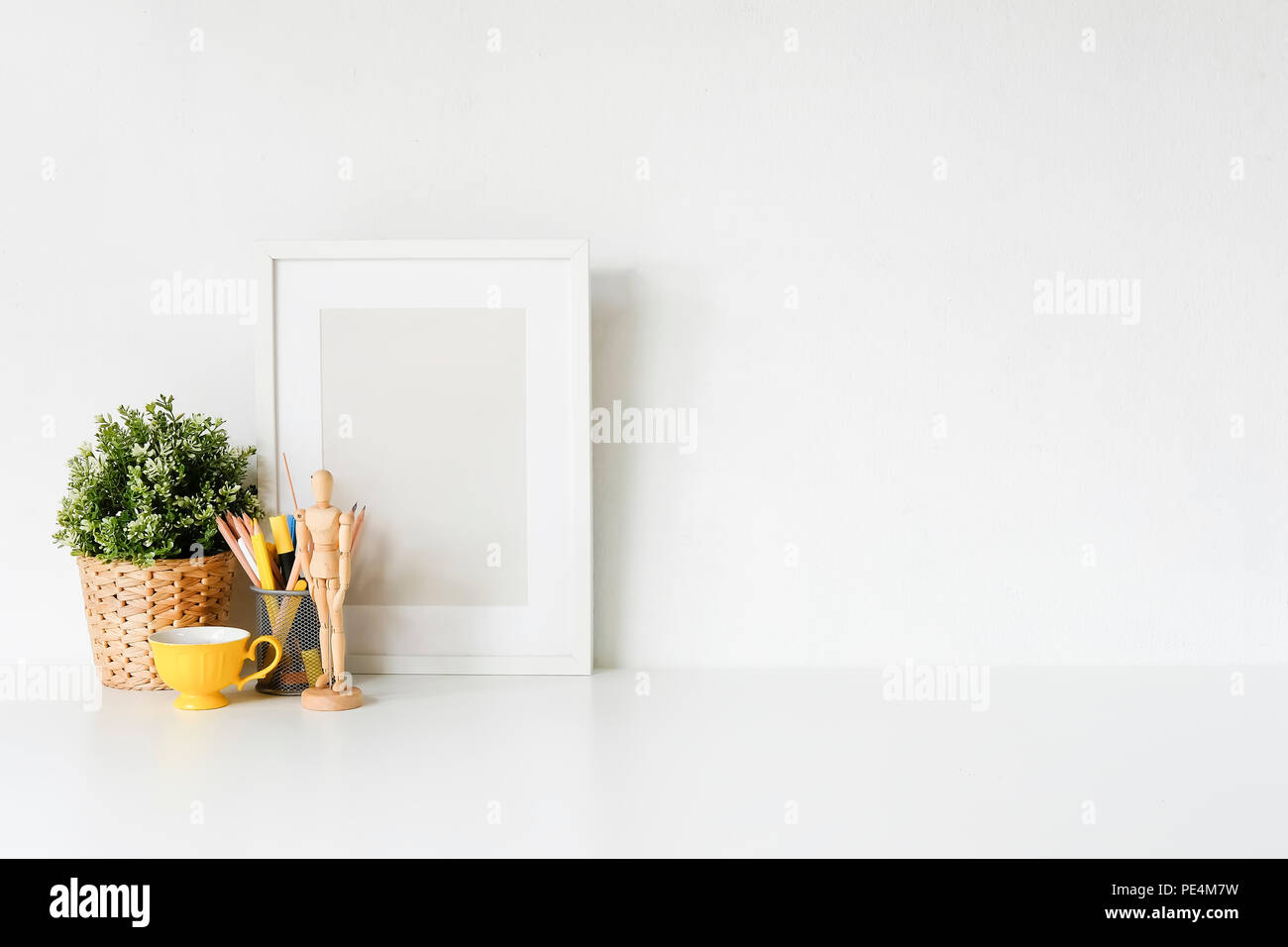 Workspace Stylish with poster and coffee cup. Workplace desk and copy ...