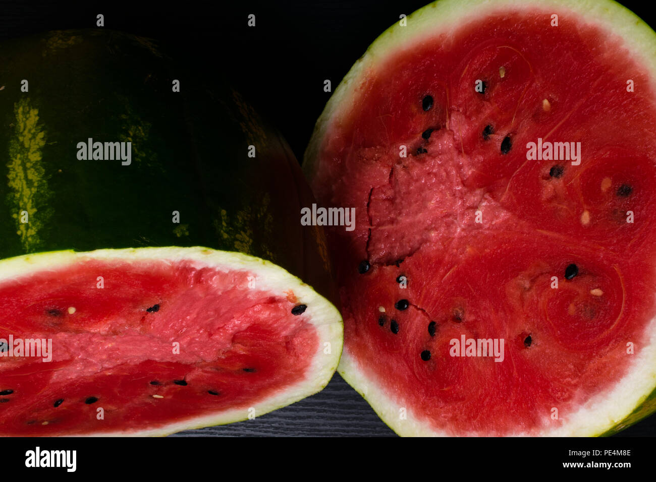 Watermelon cut in two halves hi-res stock photography and images - Alamy