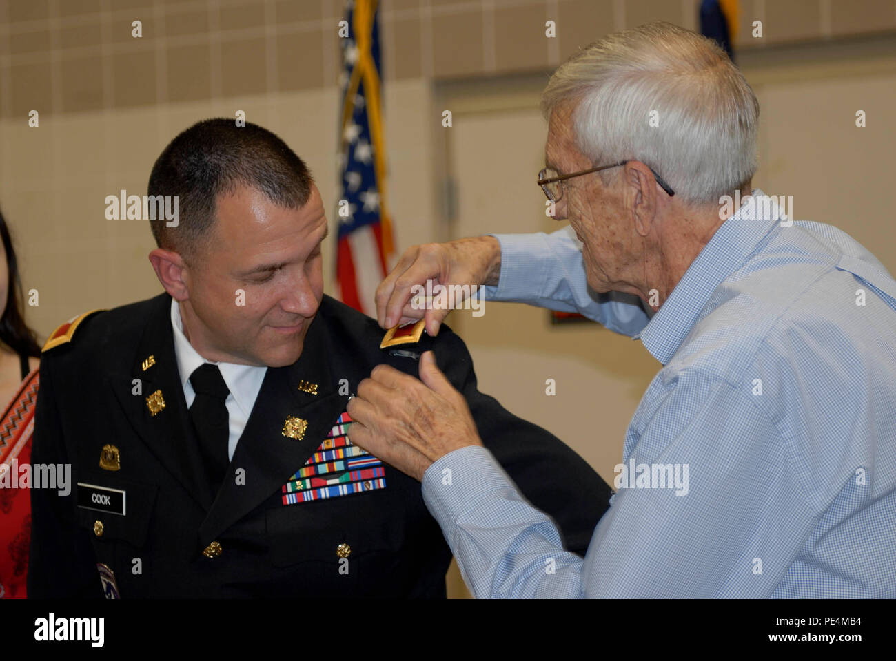The image shows a promotion ceremony at the Gerald A. Rudisill ...