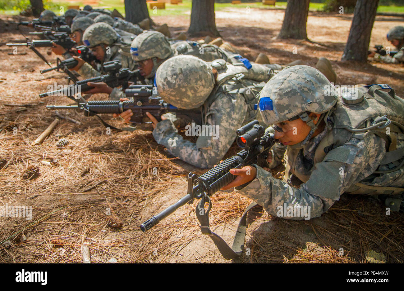 U.S. Army privates lay in the prone positions while they wait to move ...