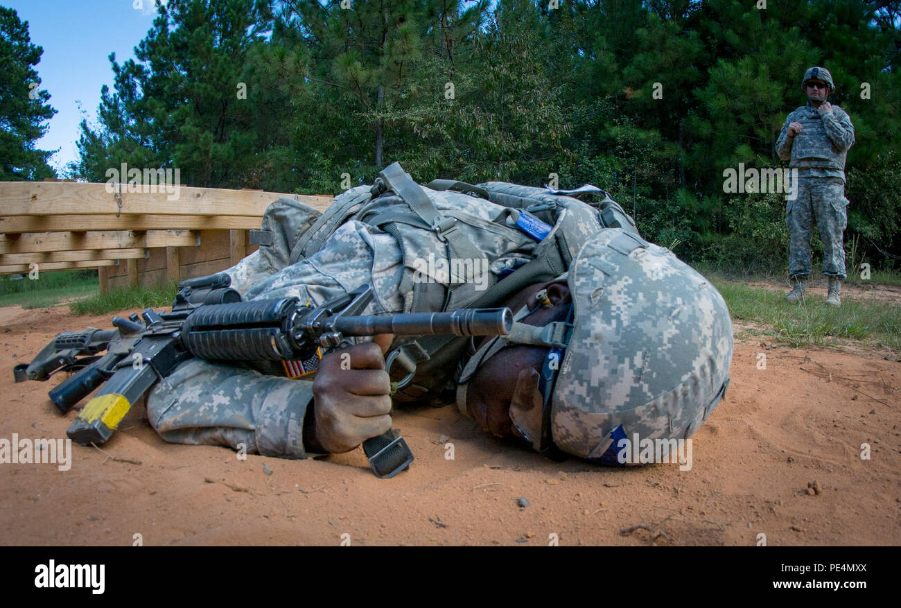 U.S. Army private Emily Karns of Dodge City, Kan., low crawls through a ...