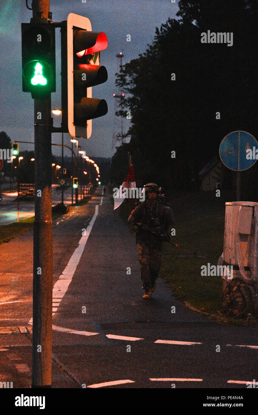 A Trooper assigned to 2nd Cavalry Regiment walked across a cross walk ...