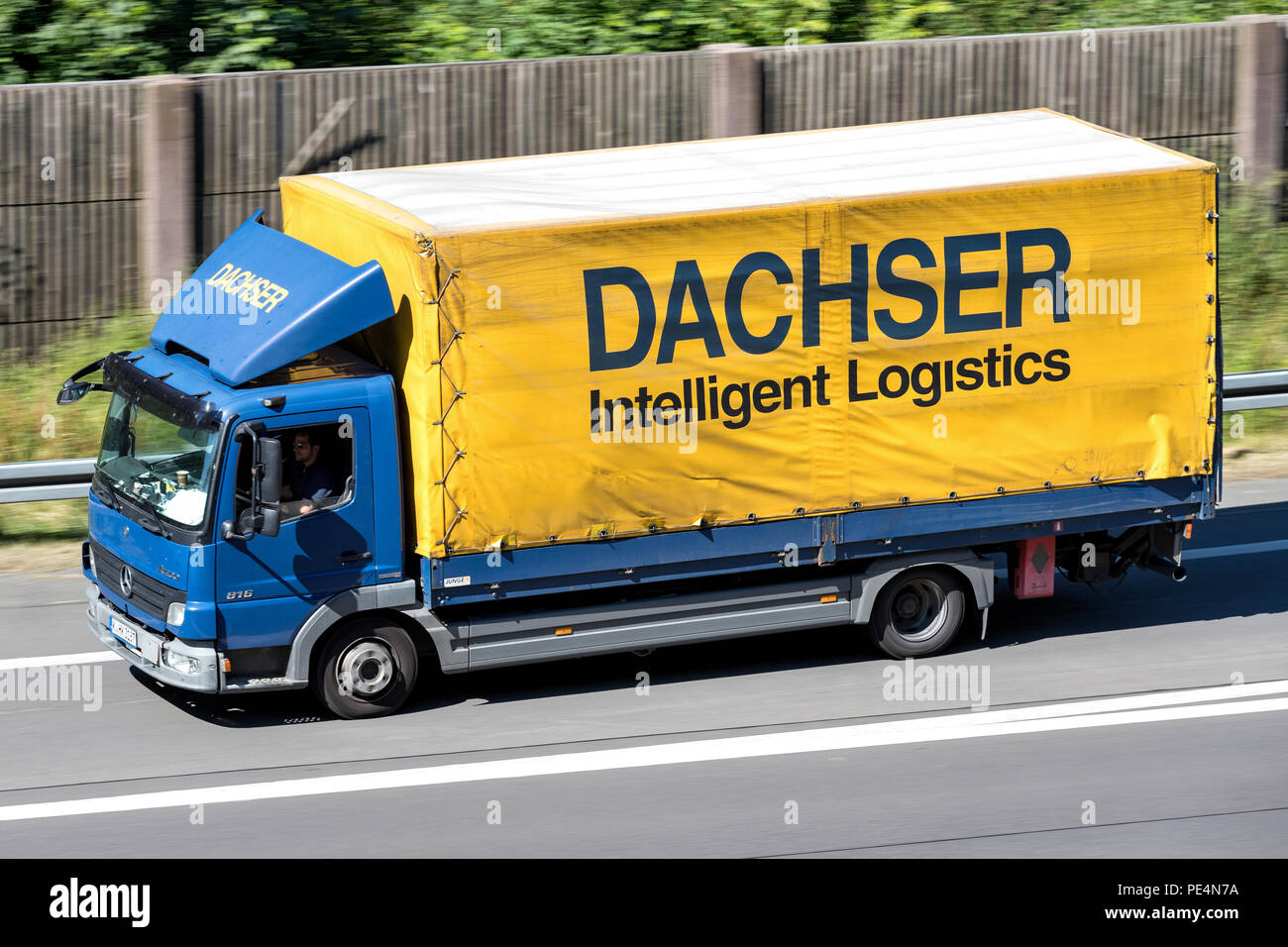 Dachser truck on motorway. DACHSER is a German logistics company ...