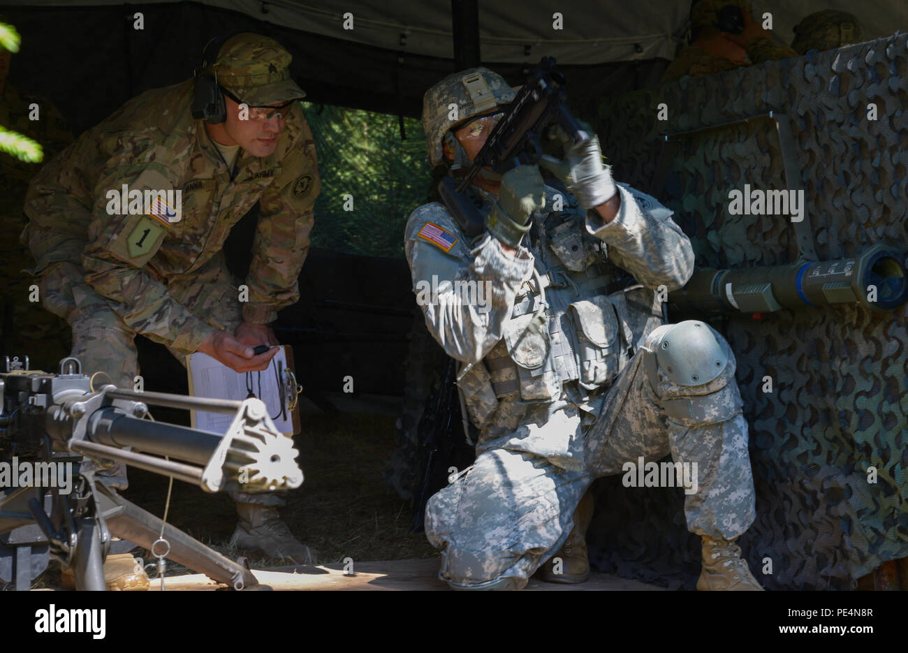 U.S. soldier assigned to 2nd Cavalry Regiment, clear, load, and unload ...