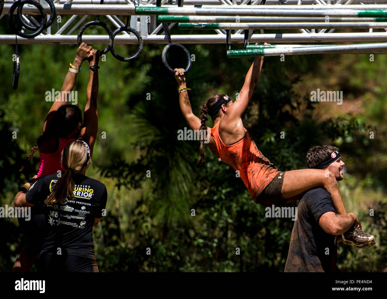 During the Spartan Sprint at Fort Bragg, N.C., participants assisted ...