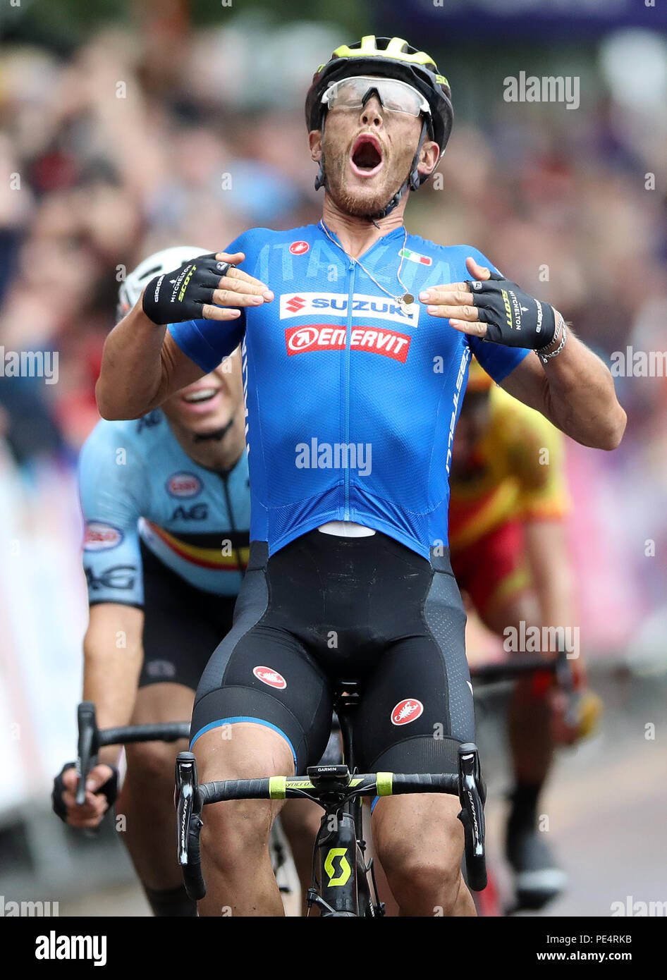 Italy's Matteo Trentin celebrates winning the Men's Road Race on day ...
