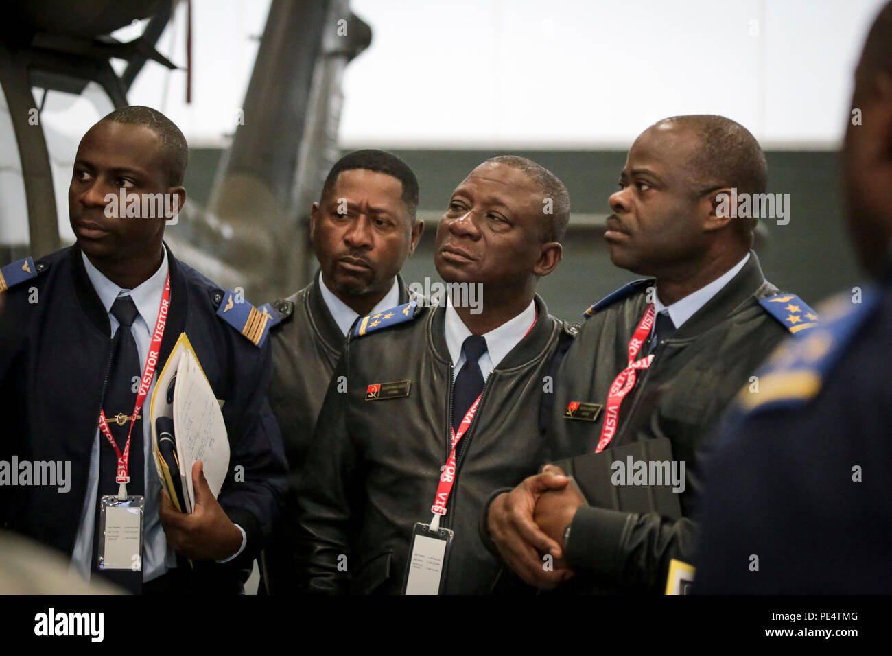 Military officers from the Republic of Angola look on as U.S. Army Capt ...