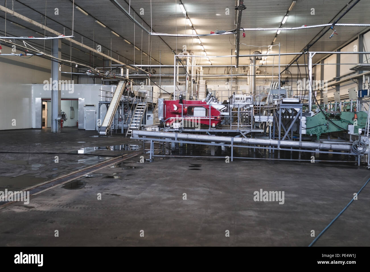 Industrial machinery interiors. Huge production hall of factory for ...