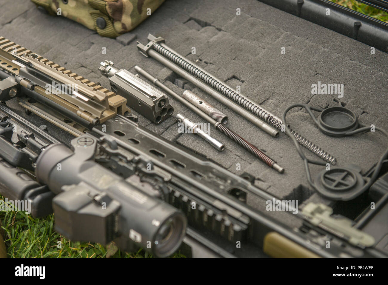 The SA-80 rifle bolt carrier group sits, disassembled during a weaopons ...
