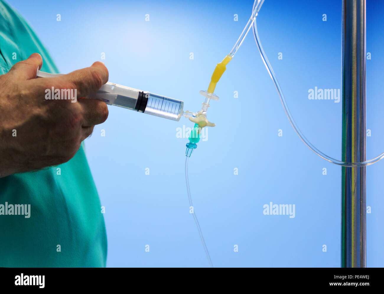 Doctor's hand and infusion drip in hospital on blurred backgroun Stock ...