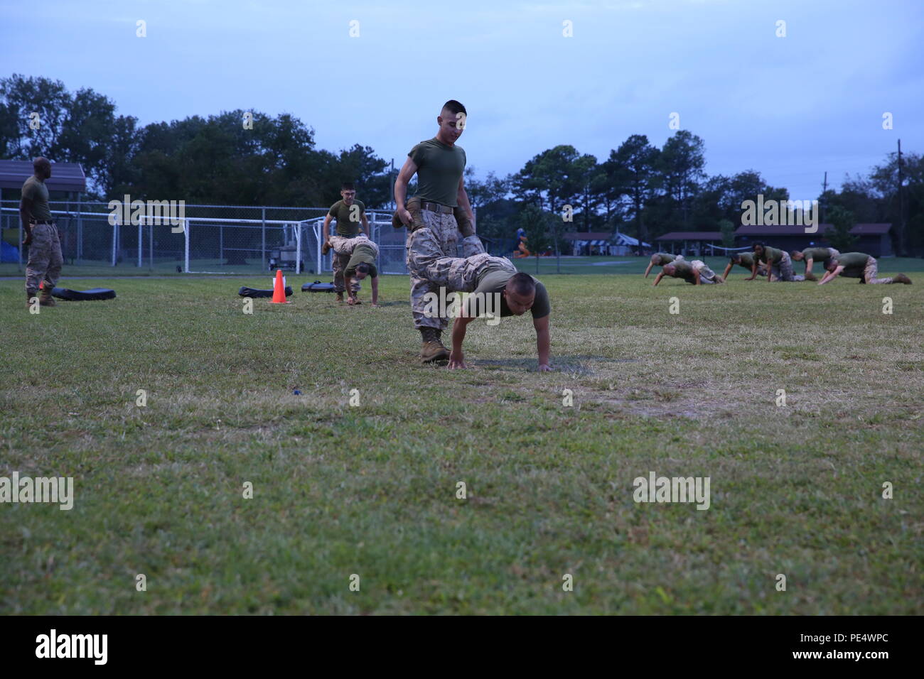 Lance Cpl. Terry Chung and Pfc. Raymond Cruz conduct a barrel crawl as ...