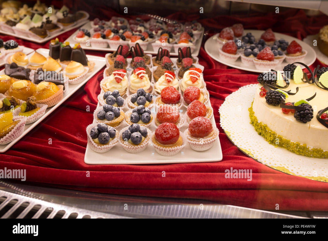 Cafe with a display of different cakes hi-res stock photography and ...