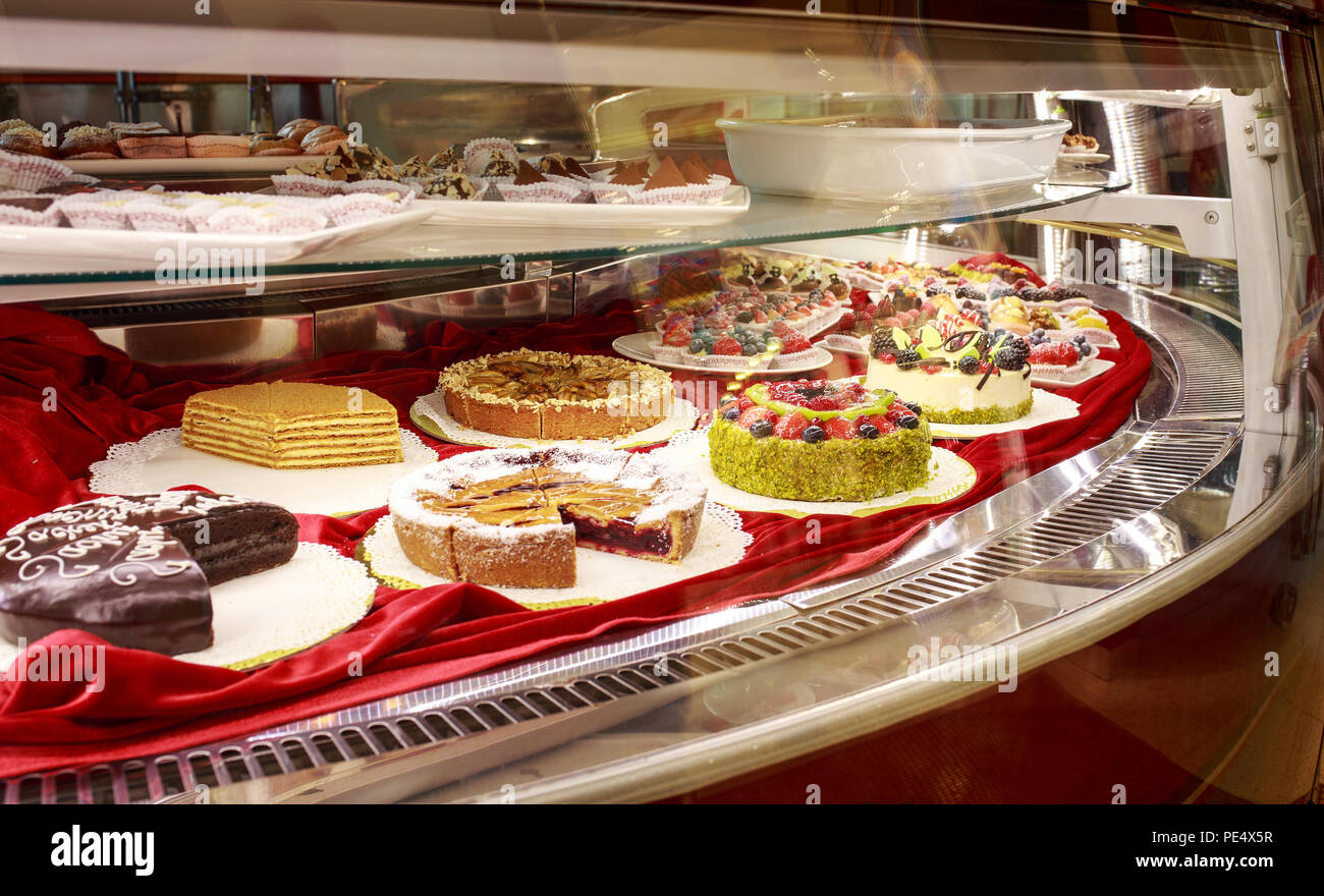 Cafe with a display of different cakes hi-res stock photography and ...